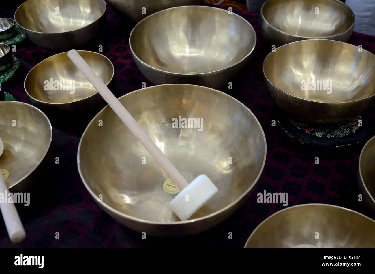 Bronze sound bowls and felt-covered sticks, which are used for sound ...