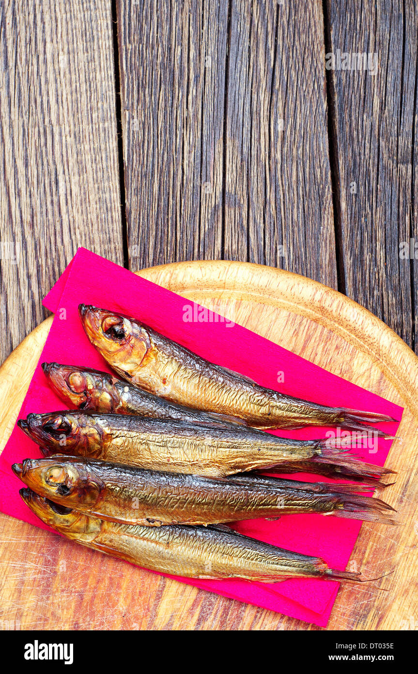 Smoked fish on cutting board Stock Photo - Alamy