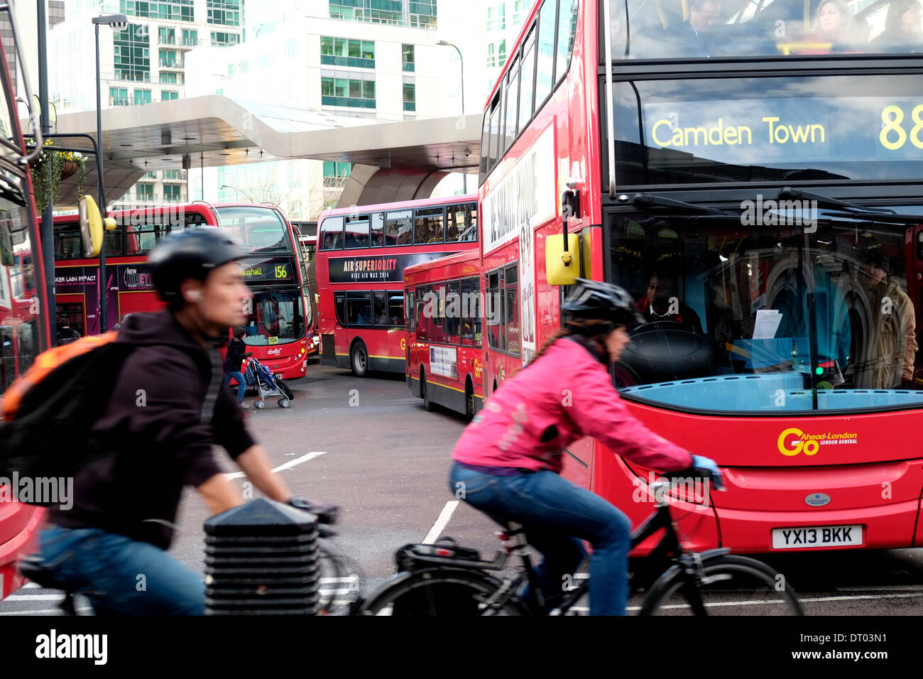 London, UK . 05th Feb, 2014. Cyclists pass buses Credit: Rachel ...
