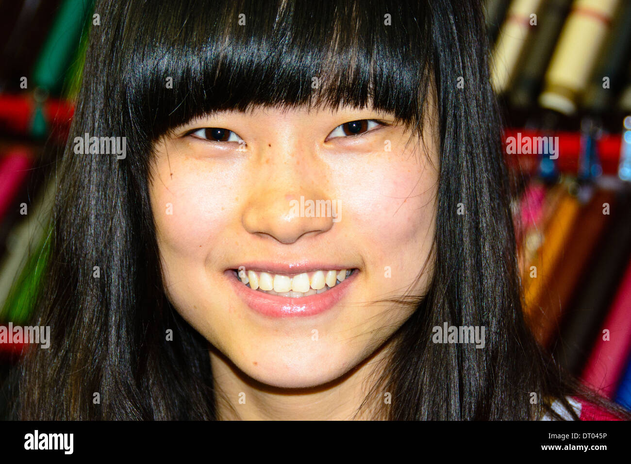 Portrait of a young smiling Chinese woman Stock Photo - Alamy