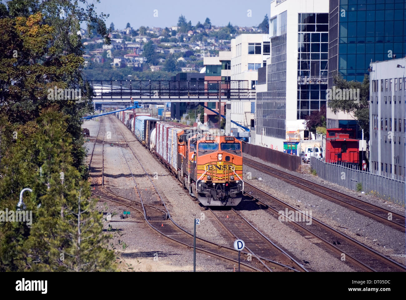 BNSE freight train hauling nearly a hundred carriages through downtown ...