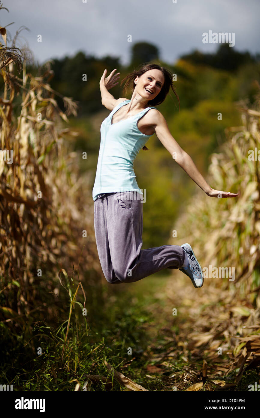 Woman jumping for joy autumn hi-res stock photography and images - Alamy