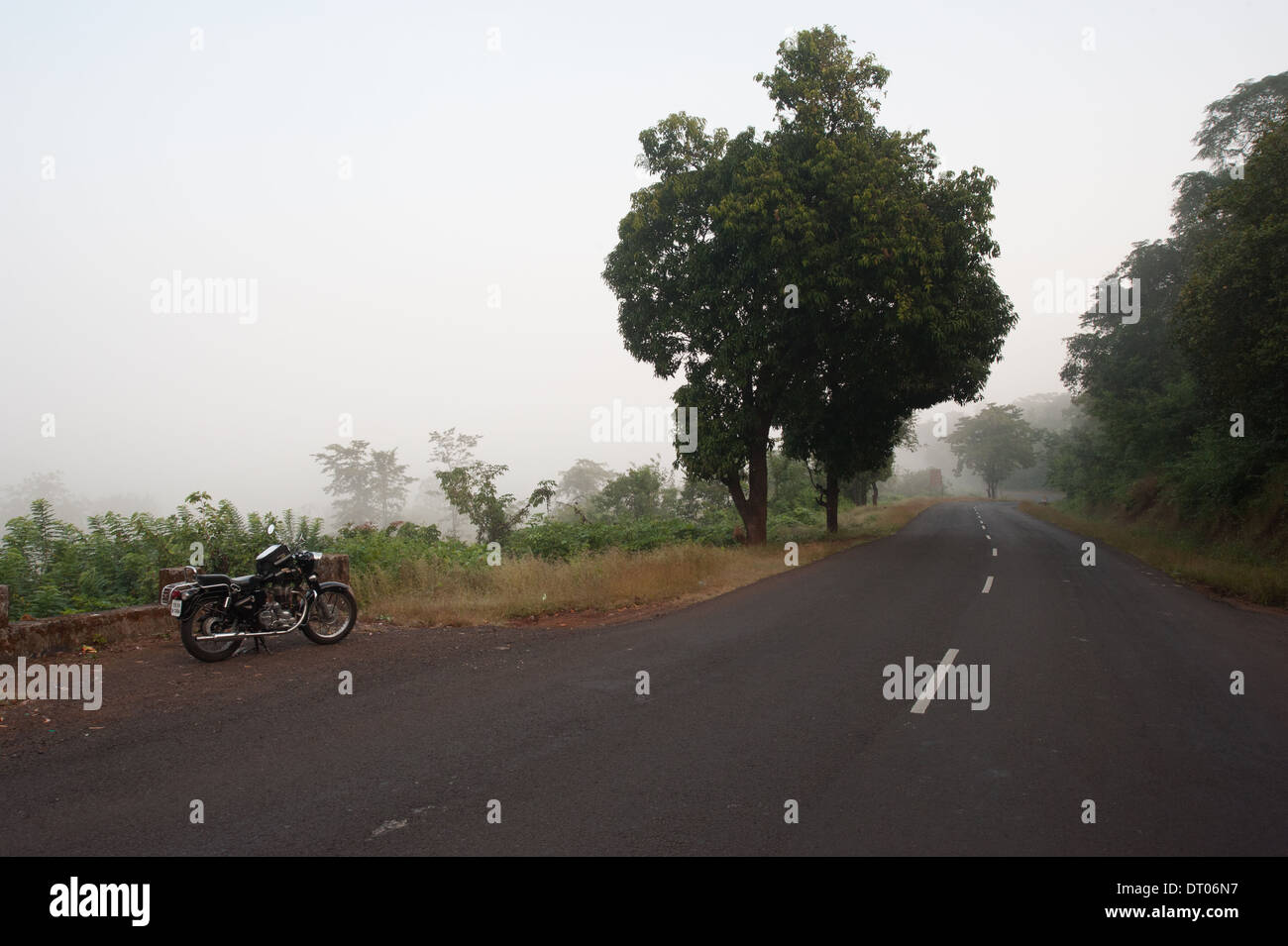 Royal Enfield on NH 17 Mumbai Goa road in morning fog Stock Photo - Alamy