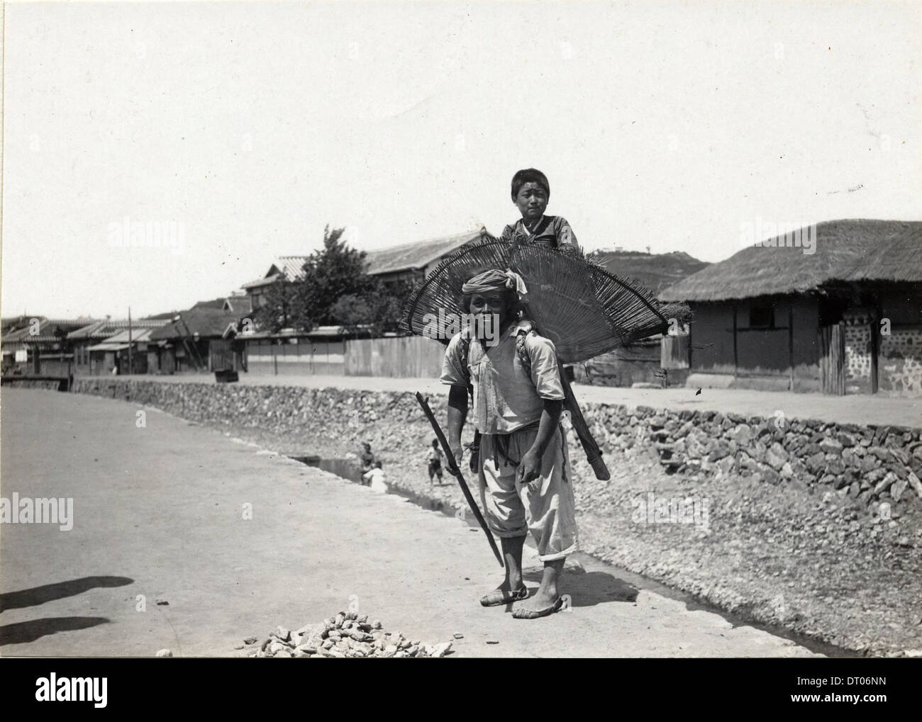 A photograph showing a boy in a traditional jiggy (swing), taken in ...