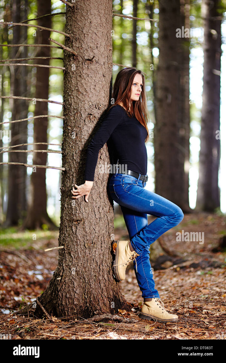 Woman leaning on a tree hi-res stock photography and images - Alamy