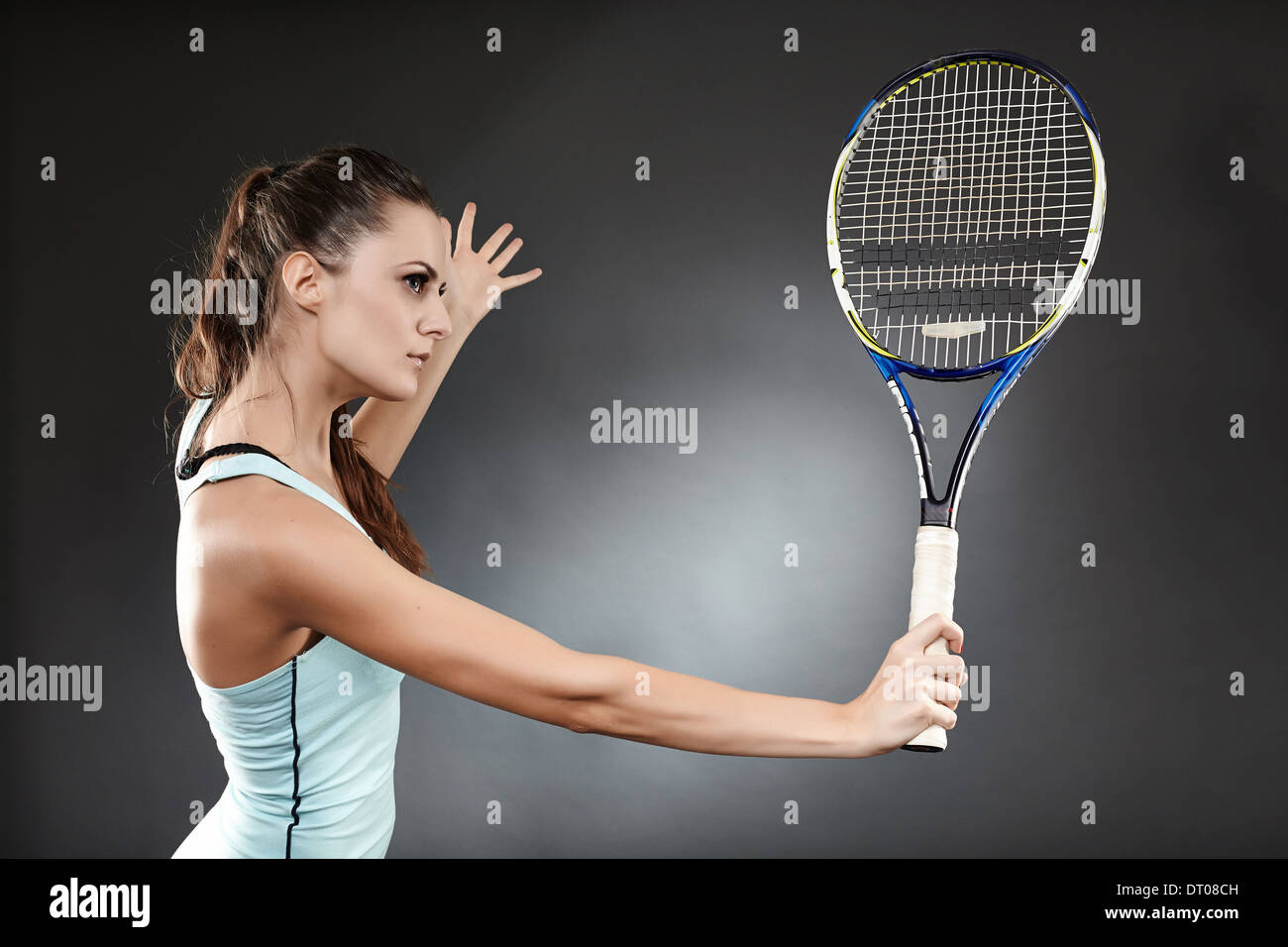 Studio shot of a female tennis player preparing to execute a backhand ...