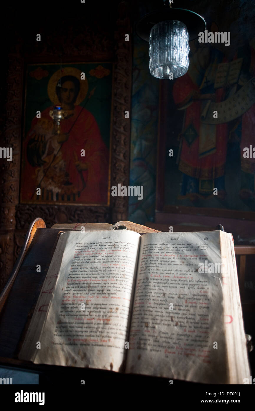Open religious book inside a orthodox church. It is written in cyrillic ...