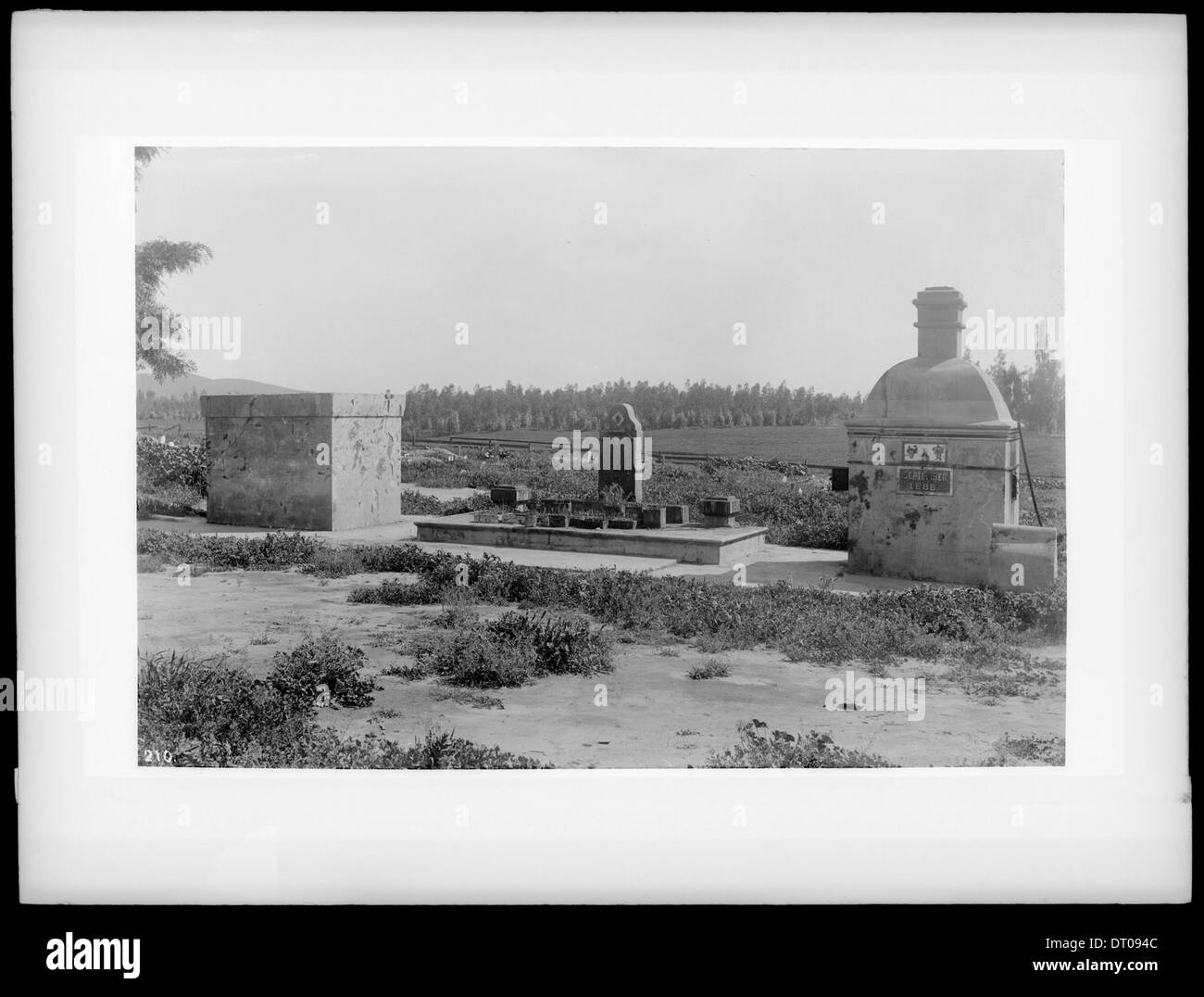 Chinese grave markers with an altar in a cemetery, photographed around ...