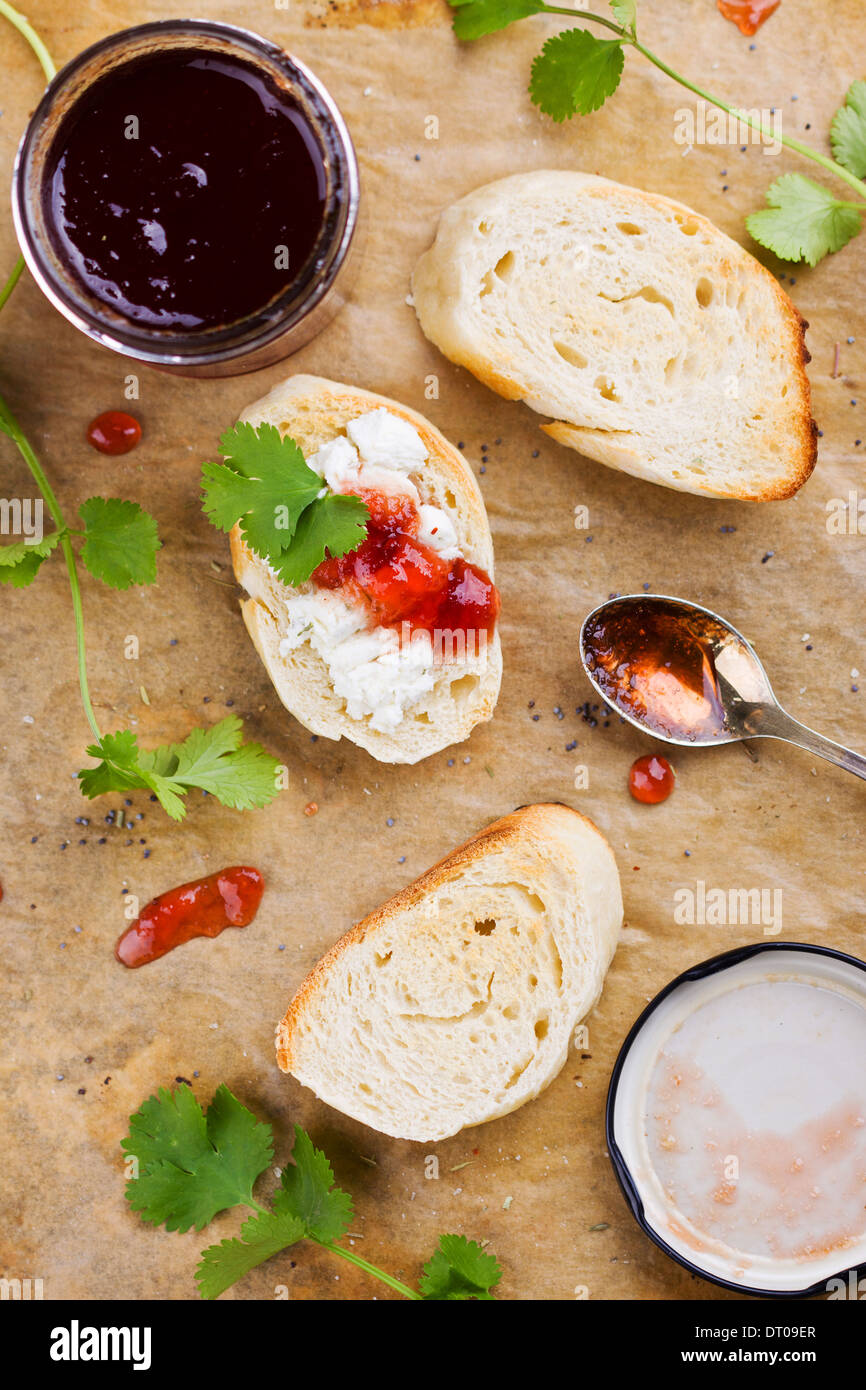 Roasted slices of bread with cheese and jam Stock Photo - Alamy