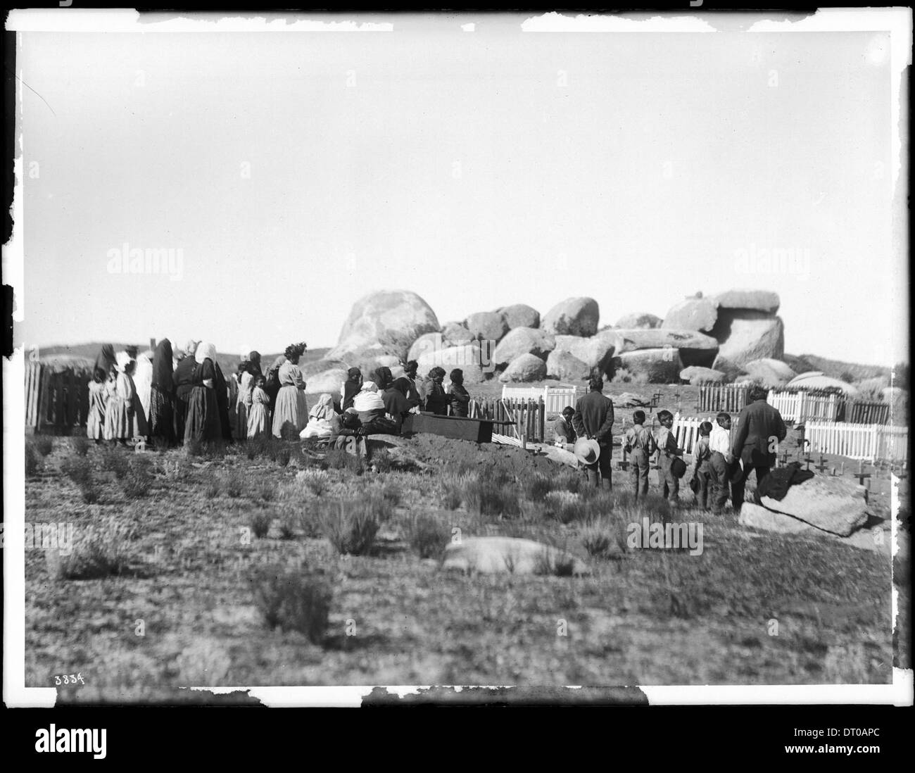 A Coahuilla Indian funeral ceremony is shown in a cemetery where ...