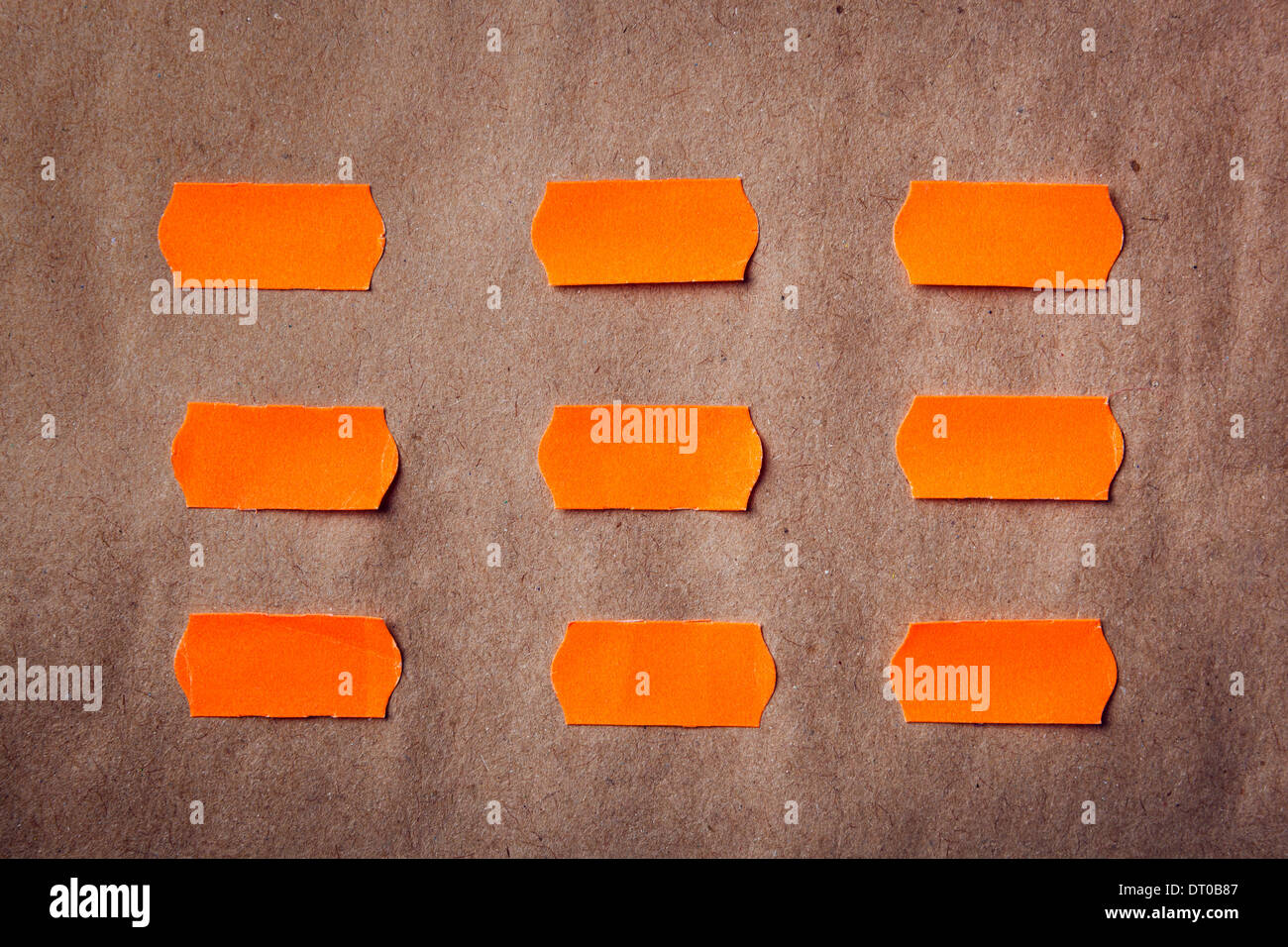 Sticky orange notes on white old paper Stock Photo - Alamy