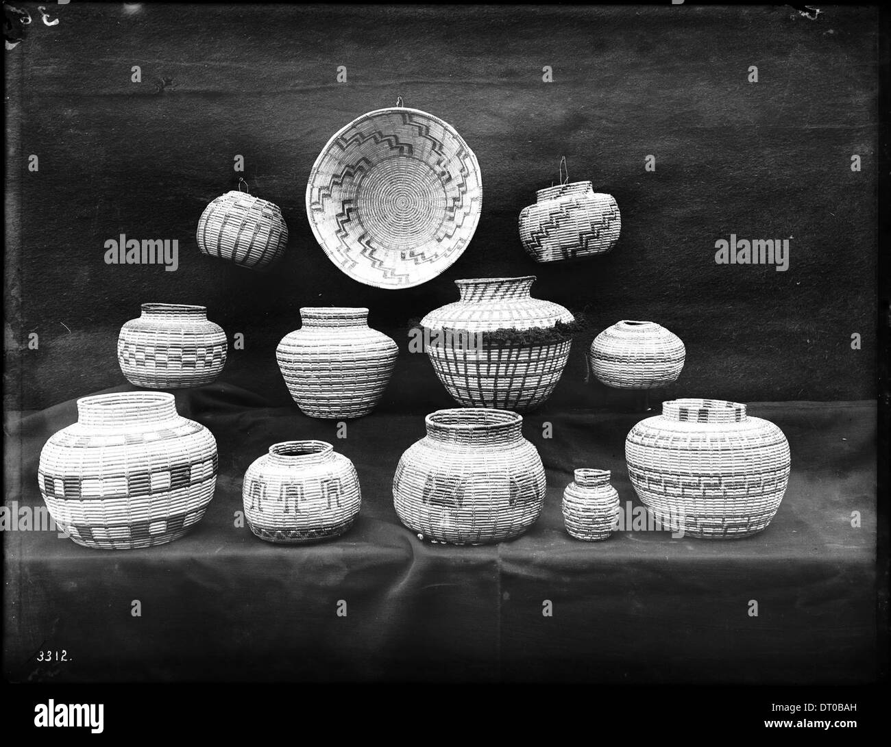 A collection of twelve Indian baskets is displayed, dating from around ...