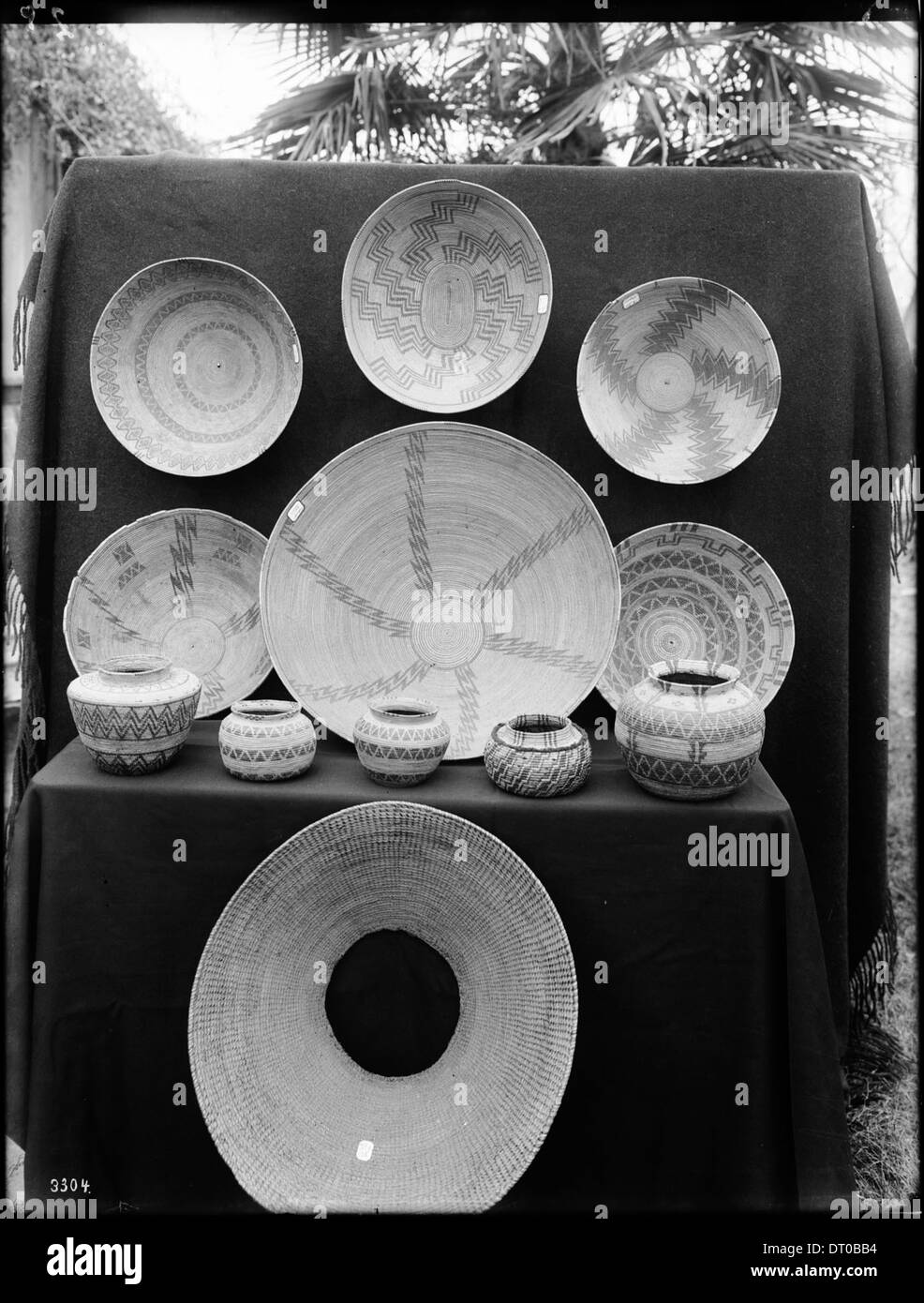 A collection of 12 Indian baskets is on display, showing various ...