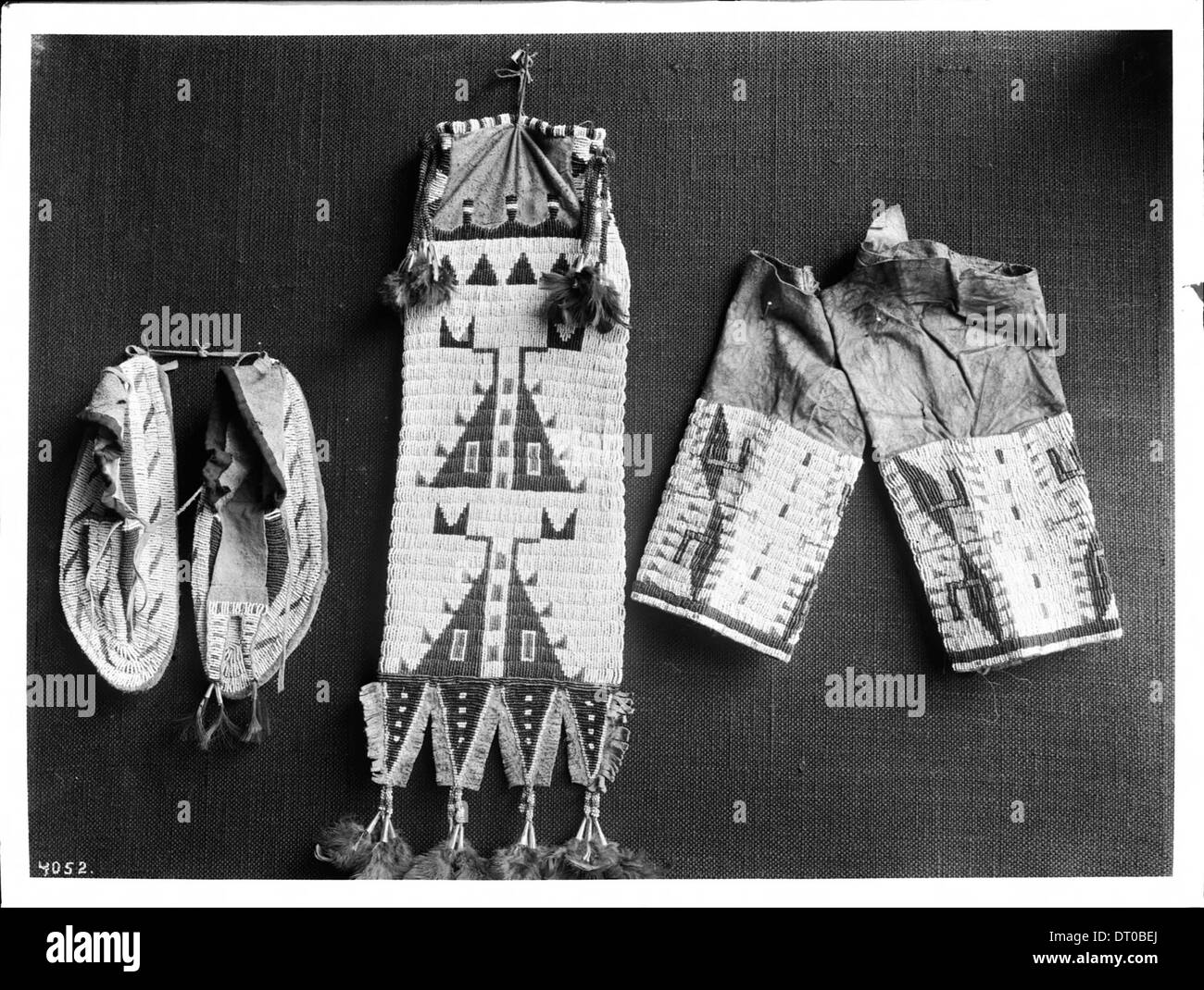A collection of three Sioux Indian beadwork pieces is displayed ...