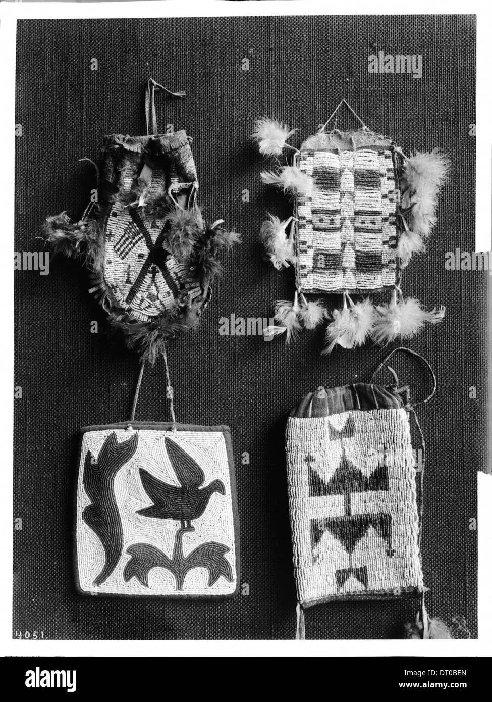 A collection of four pieces of Sioux Indian beadwork on display ...