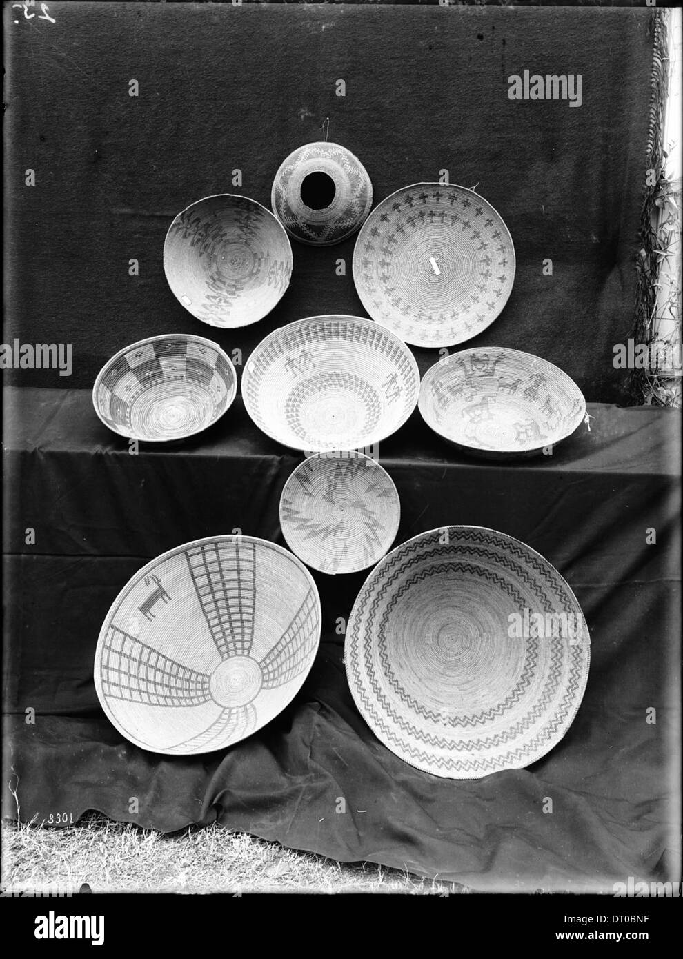 A collection of nine traditional Indian baskets displayed, dating from ...