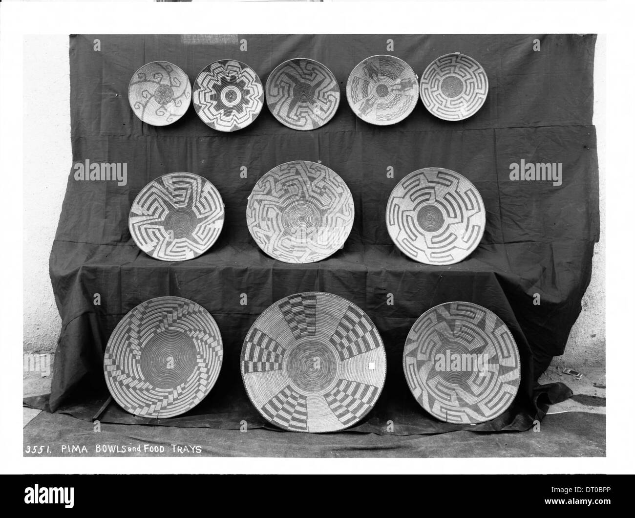 A photograph showcasing a collection of Pima Indian baskets, bowls, and ...
