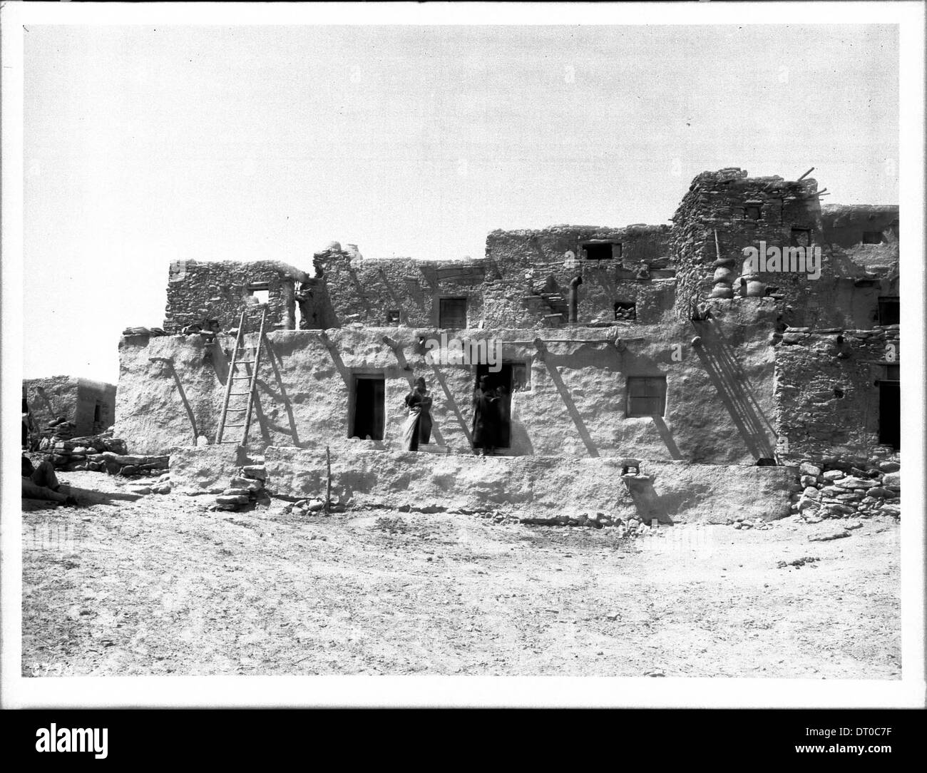 A photograph showing the construction of an addition to a native ...