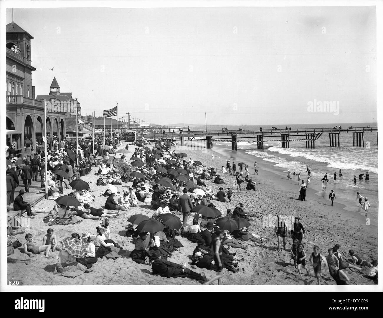 A crowded scene at Santa Monica Beach, around 1900, depicting people ...