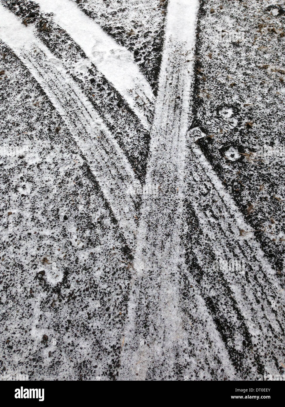 Tread marks on icy pavement Stock Photo - Alamy
