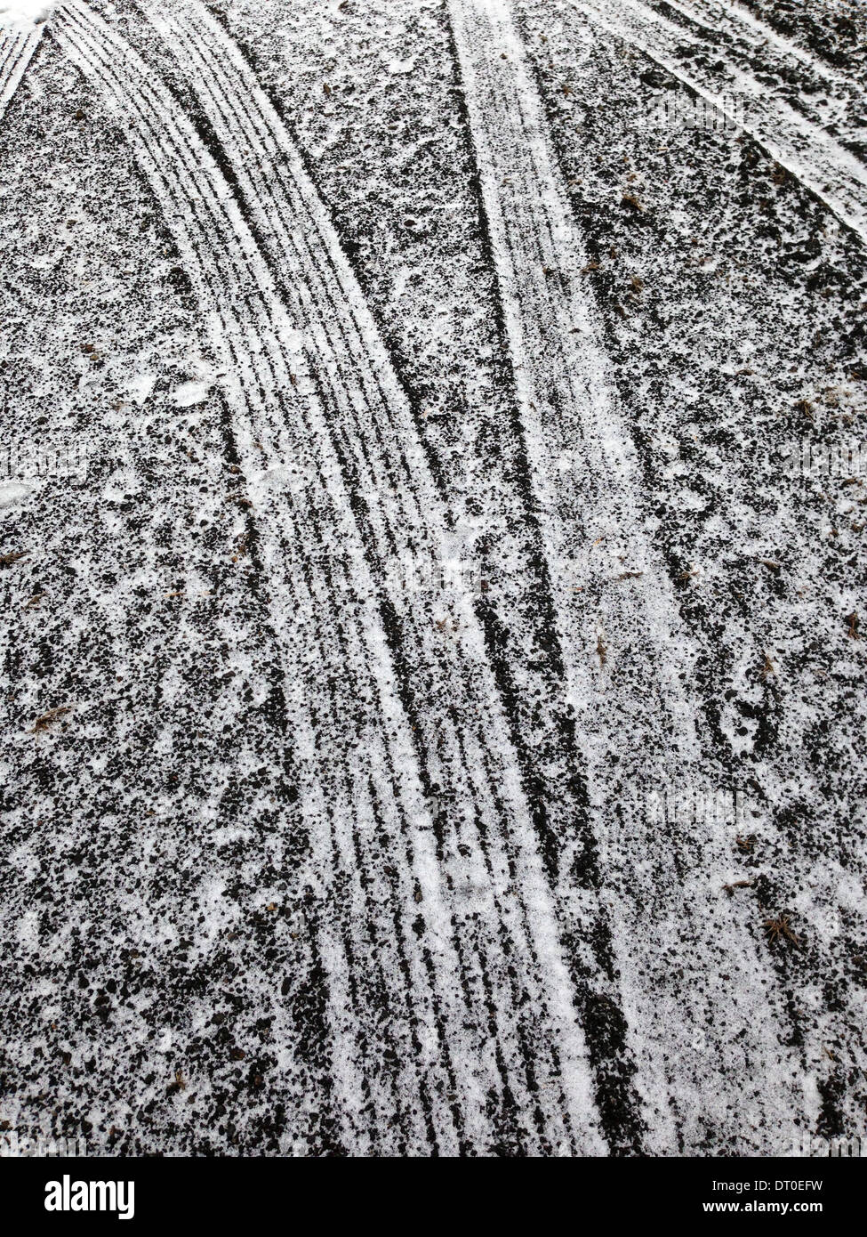 Tread marks on icy pavement Stock Photo - Alamy