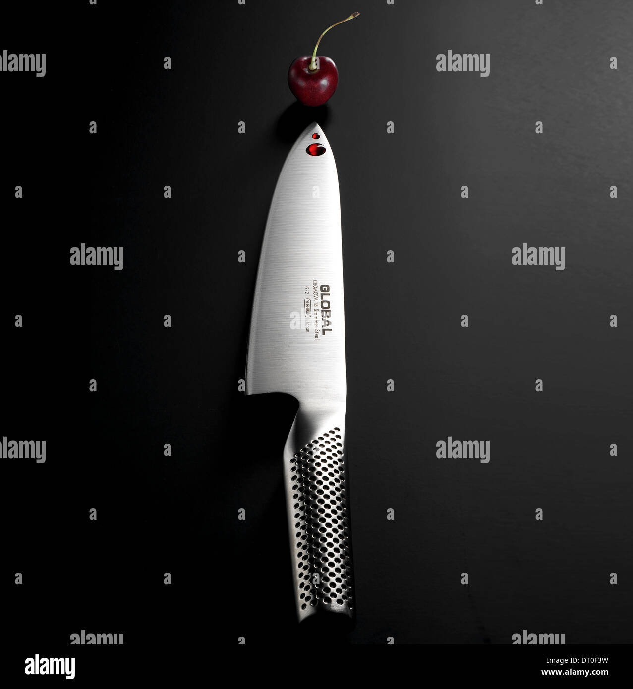 Knife with Cherry Stock Photo - Alamy