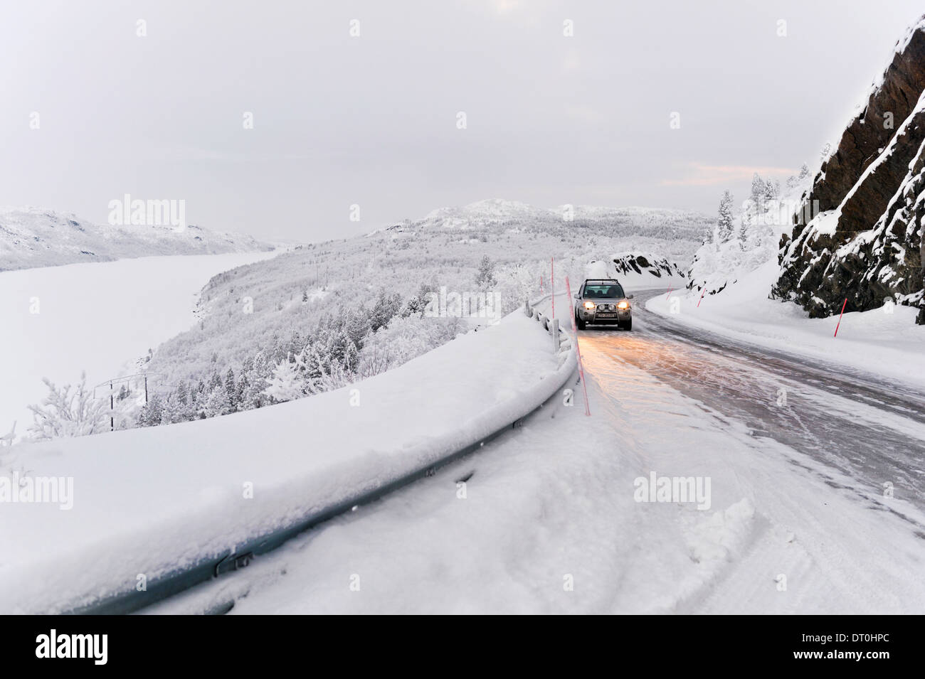 Snow covered Winter road and frozen fjord near Kirkenes, Finnmark ...