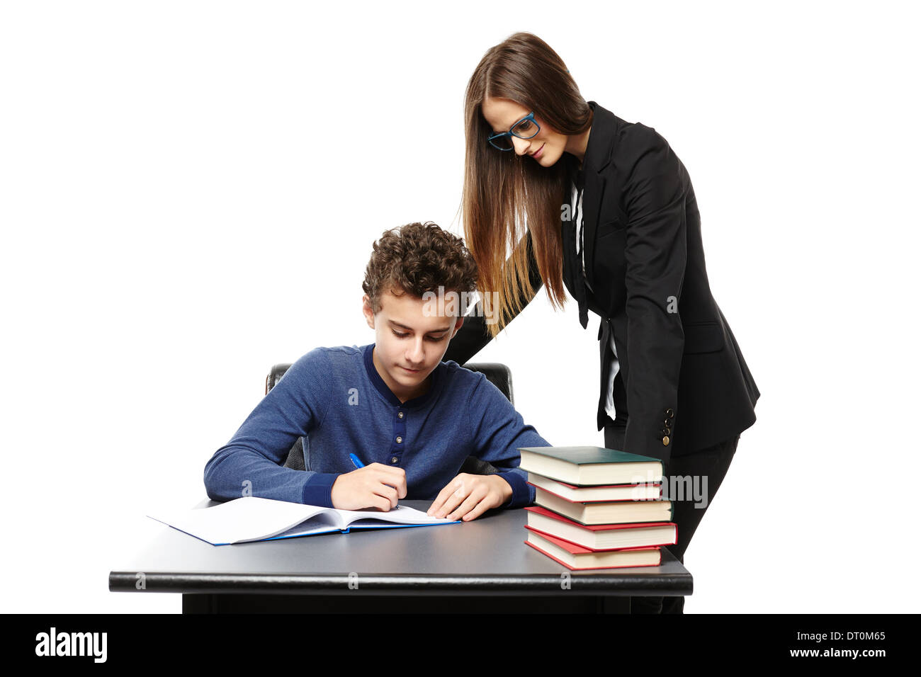 Two students desk teacher standing hi-res stock photography and images ...