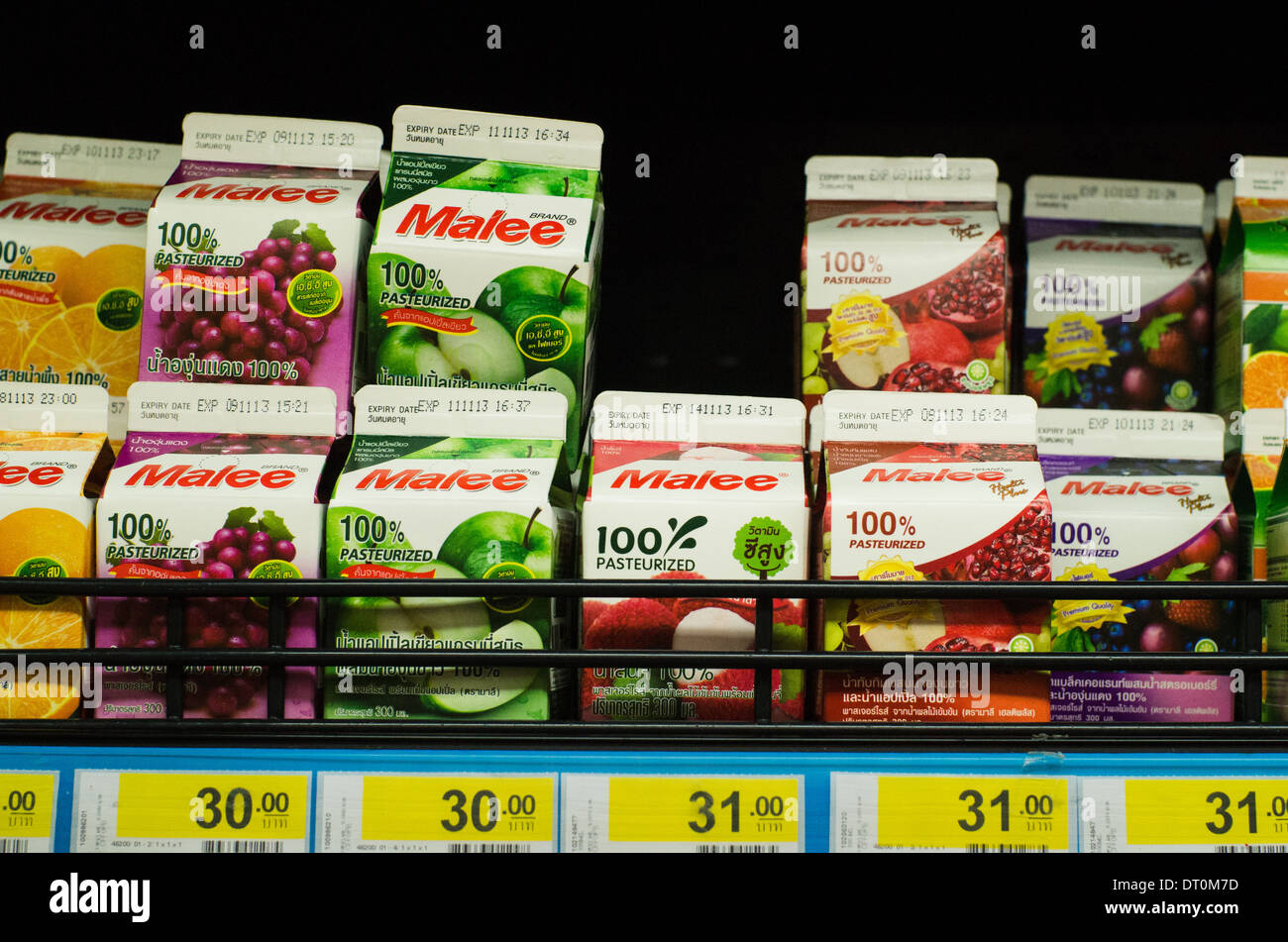Variety of fruit juice beverage display on shelf of a thailand ...