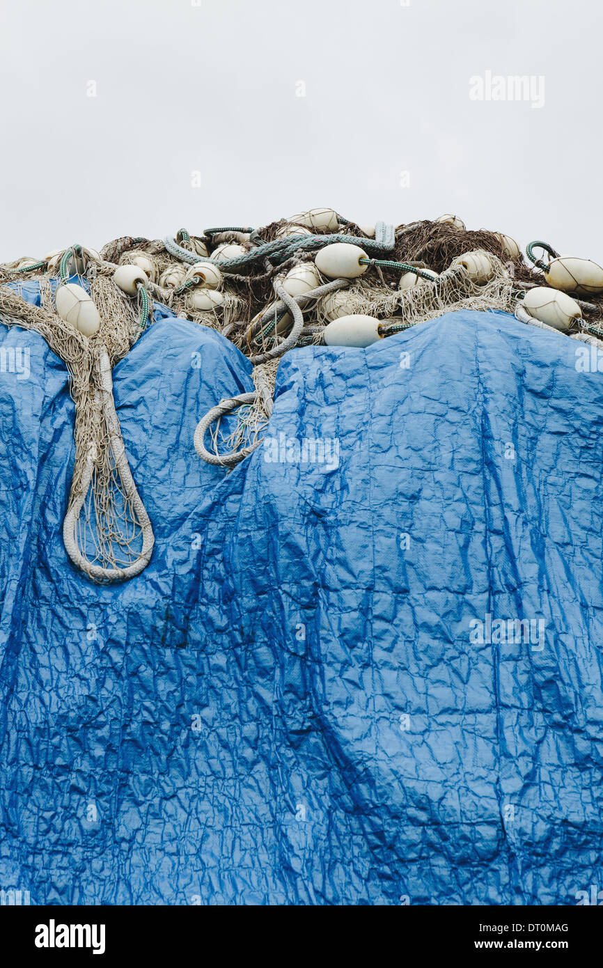 Seattle Washington USA blue tarpaulin covering commercial fishing nets ...