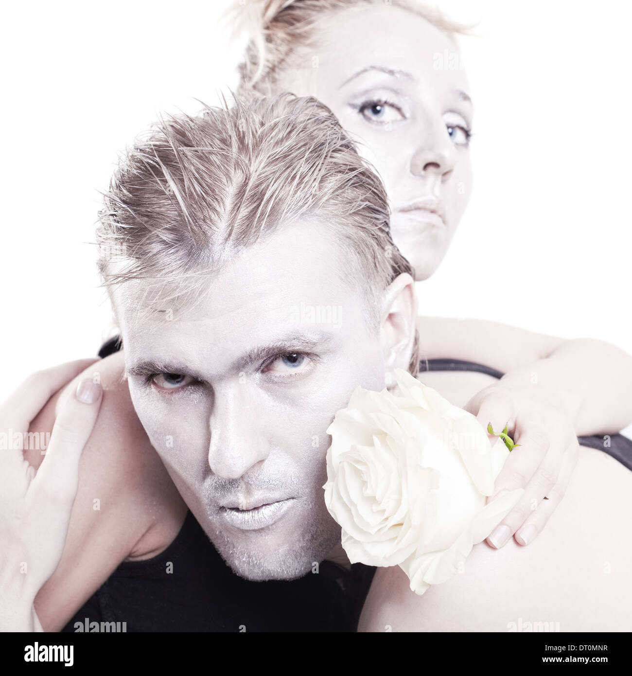 Square portrait of Young couple in love with a white rose and silver ...