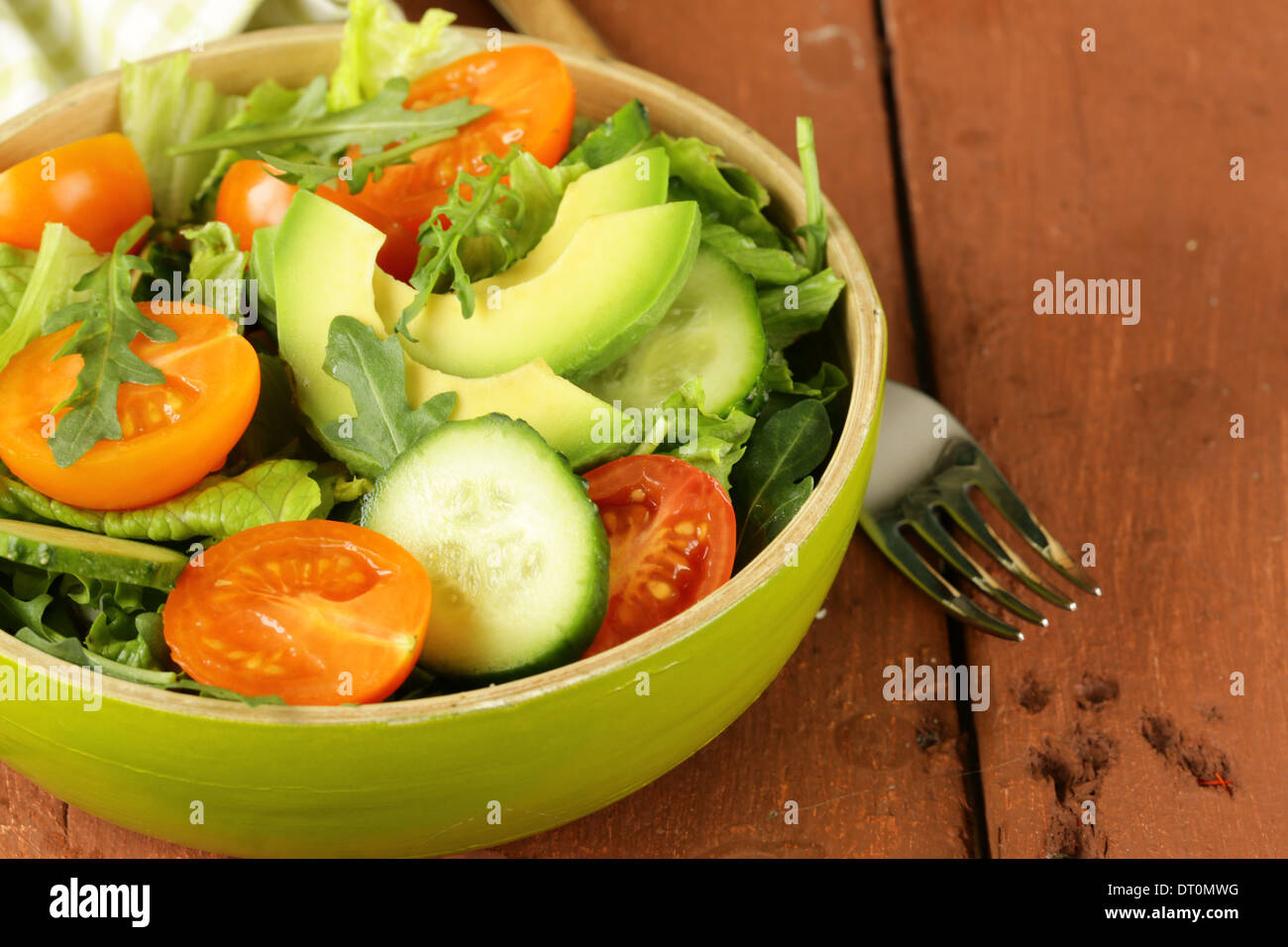 vegetable salad with avocado and tomatoes in rustic style Stock Photo ...