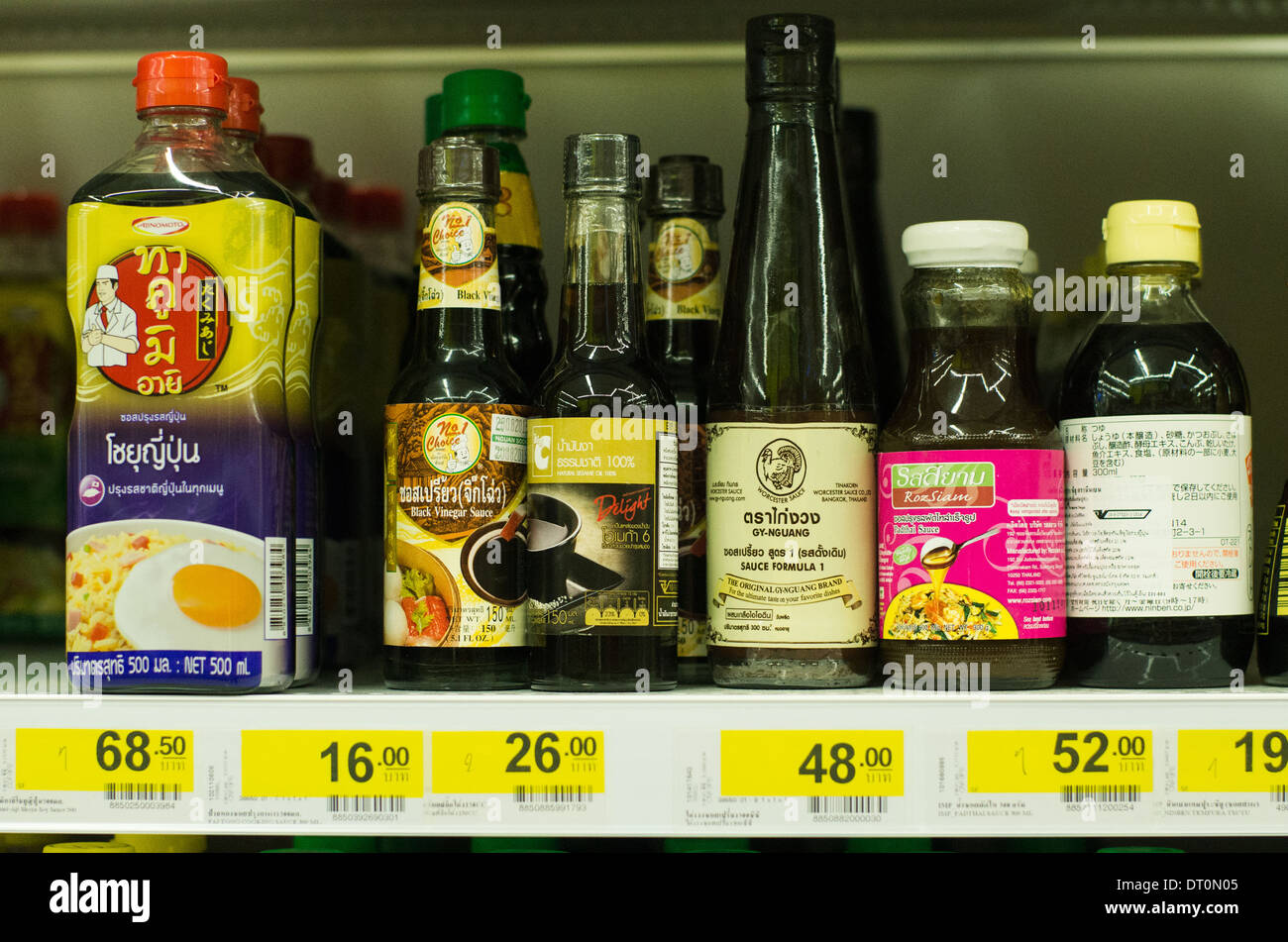 Variety of soy sauce and condiment on shelf of supermarket in Bangkok ...