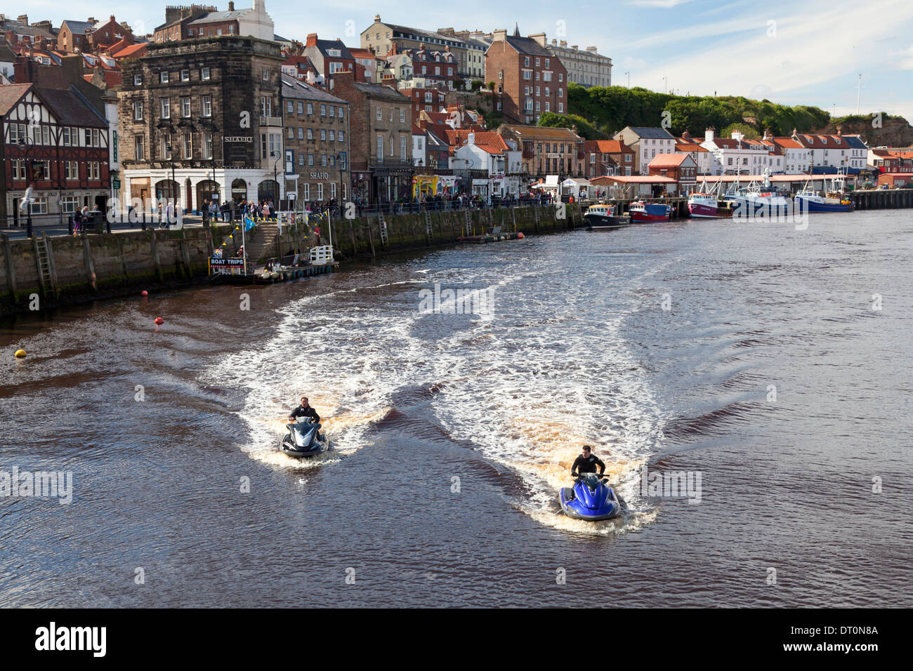 Two jet skis entering Whitby harbour, Whitby, North Yorkshire Stock ...