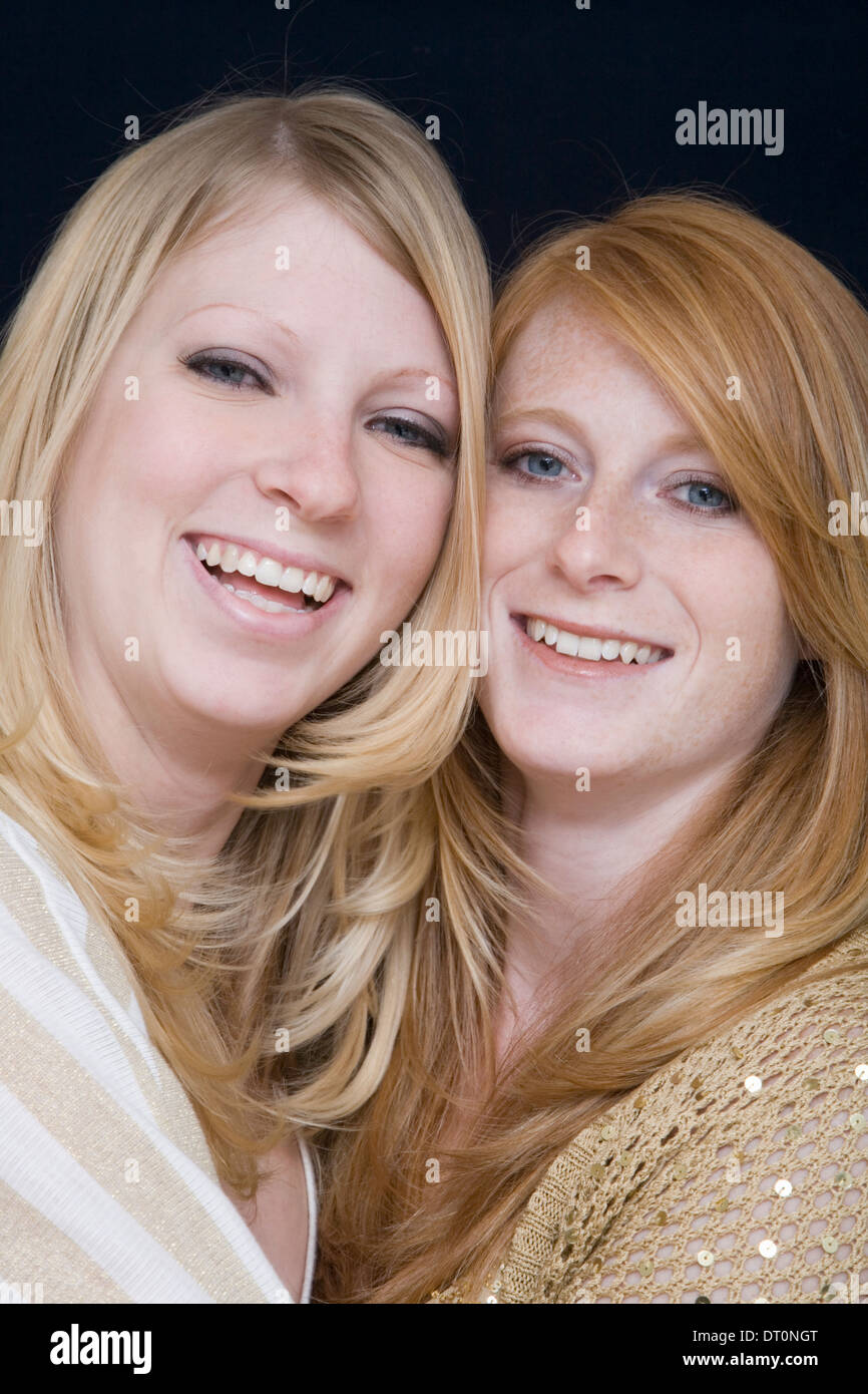 Studio portrait of two women smiling Stock Photo - Alamy