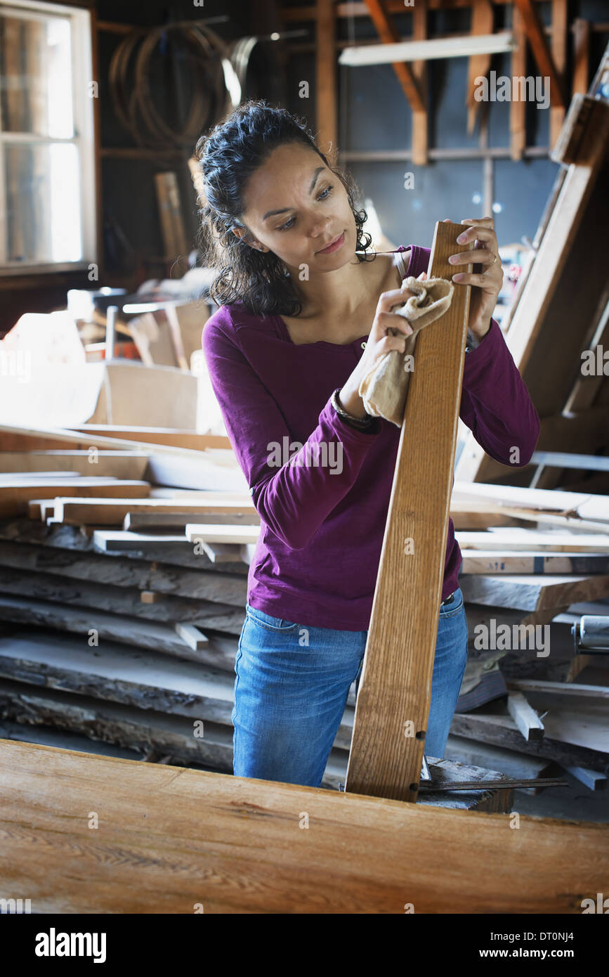 Woodstock New York USA woman working with reclaimed timber woodwork ...
