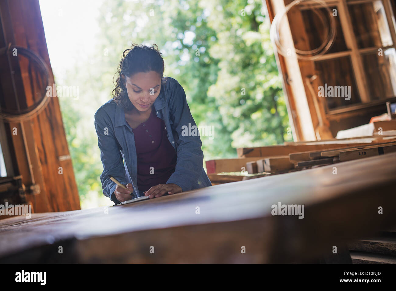 Woodstock New York USA woman reclaimed timber woodwork workshop Stock ...