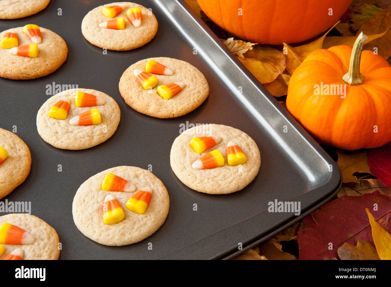 Pan of cookies decorated with candy corns for Halloween Stock Photo - Alamy