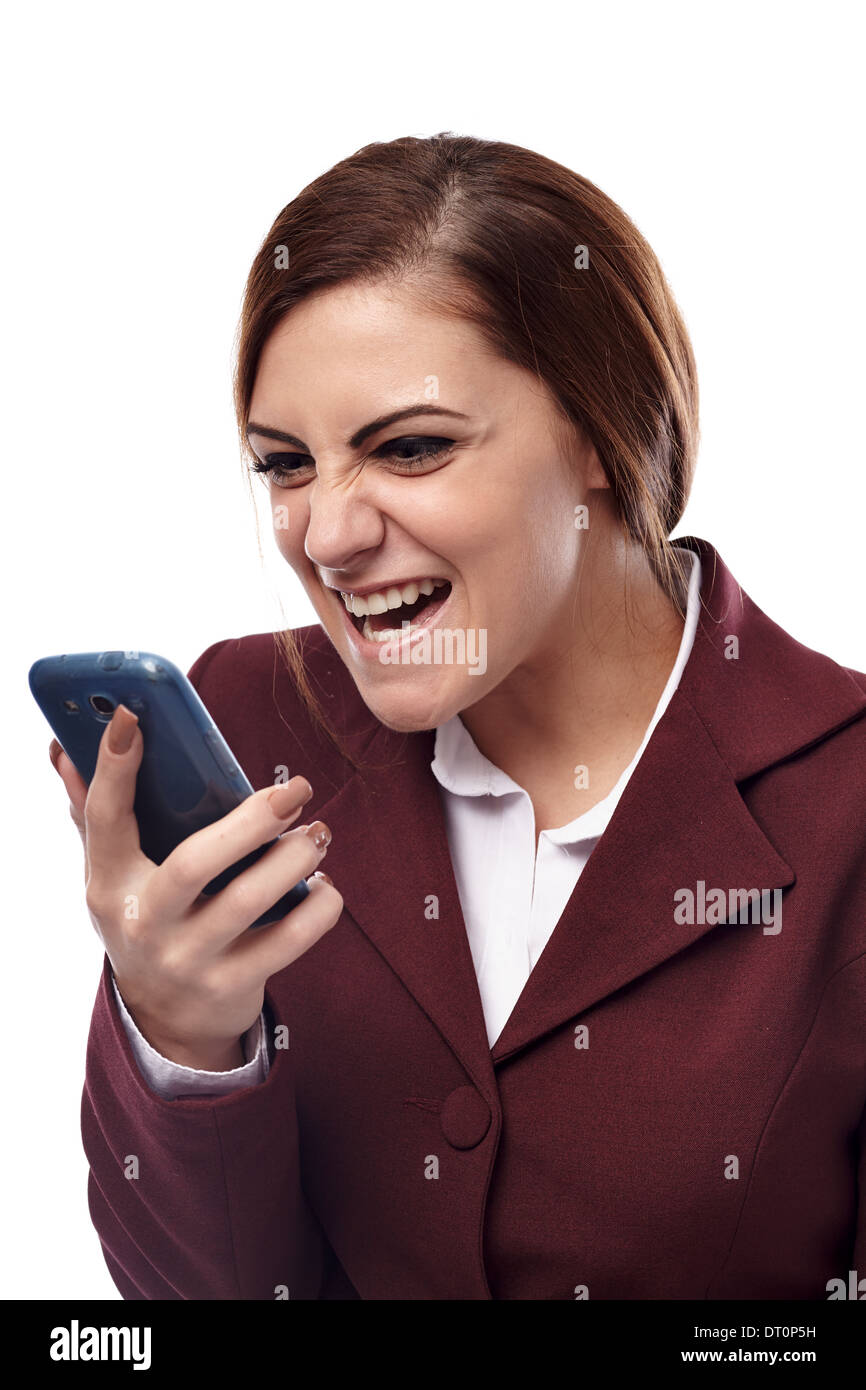 Portrait of angry businesswoman holding a cell phone and screaming into ...