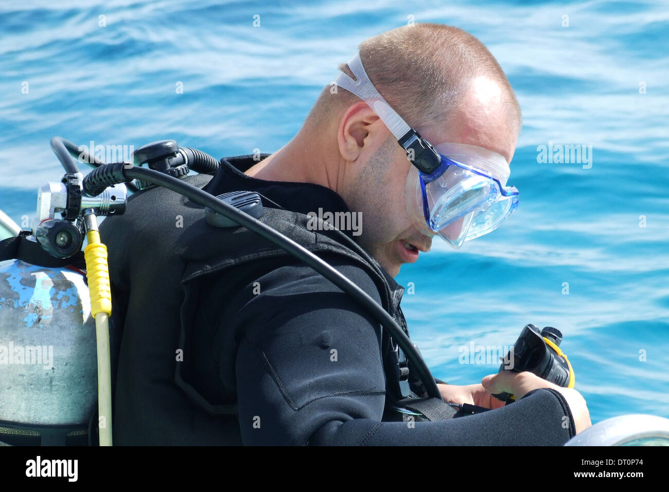 scuba diver on boat before diving Stock Photo - Alamy
