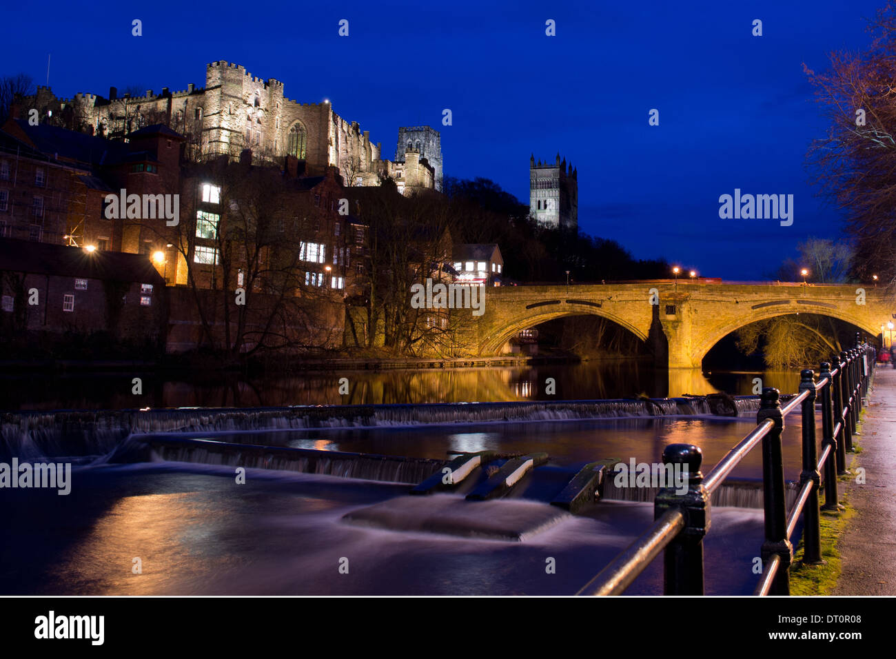 Durham Castle and Cathedral from the banks of the river Wear at dusk ...