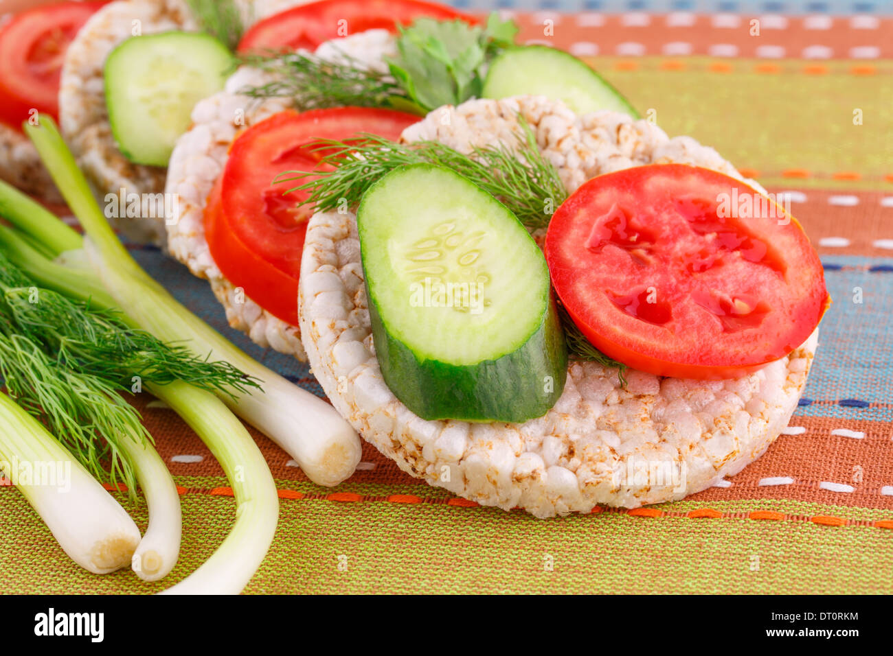 Puffed rice crackers sandwiches with vegetables on tablecloth Stock ...