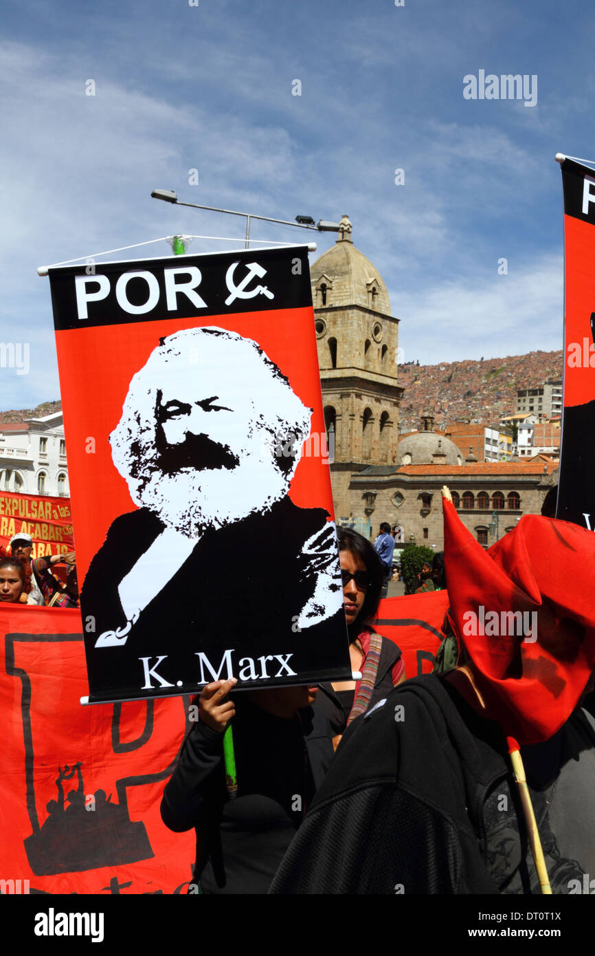A members of the Revolutionary Workers Party carries a picture of Karl ...