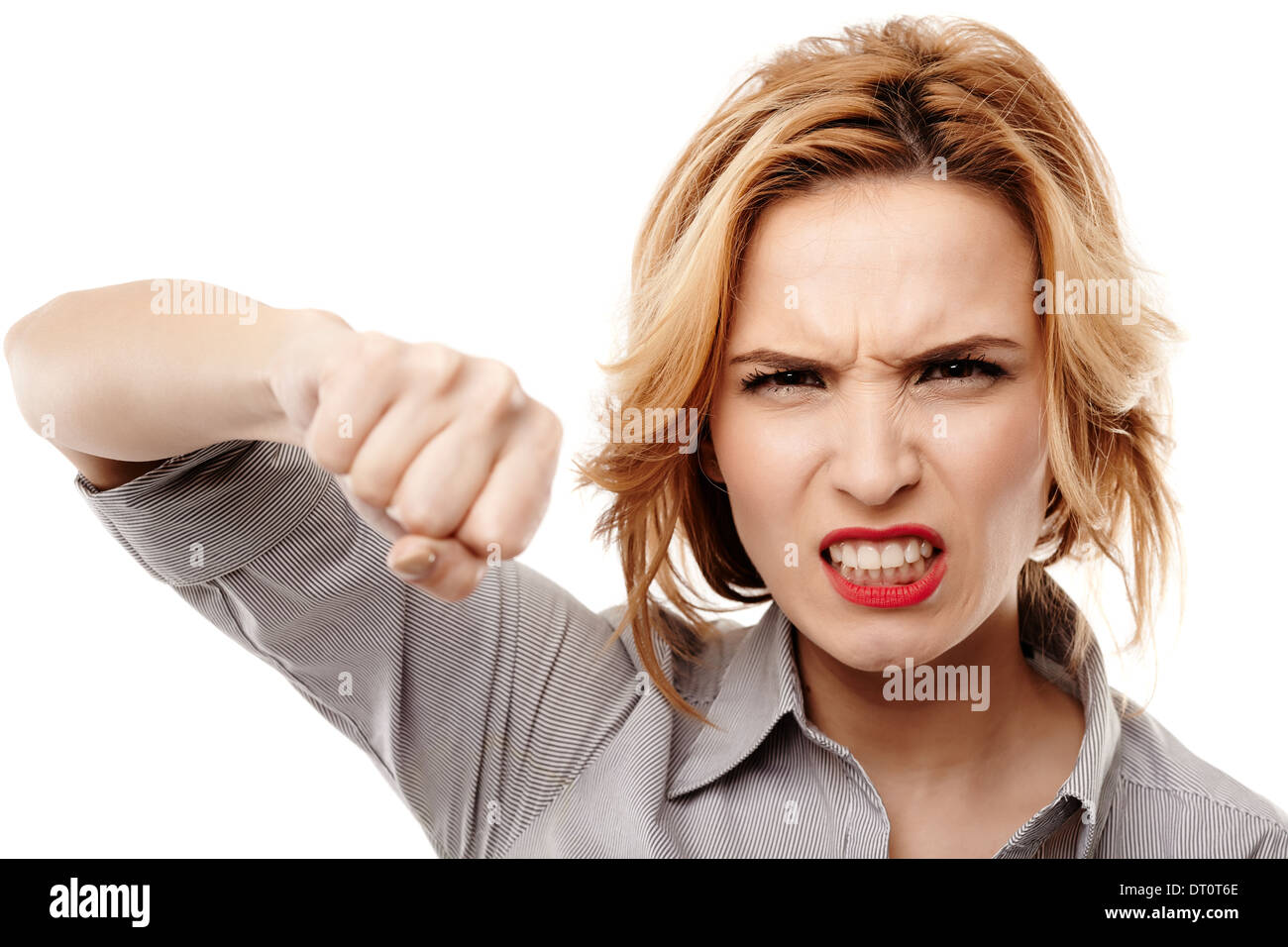 Closeup of angry businesswoman punching, isolated on white background ...