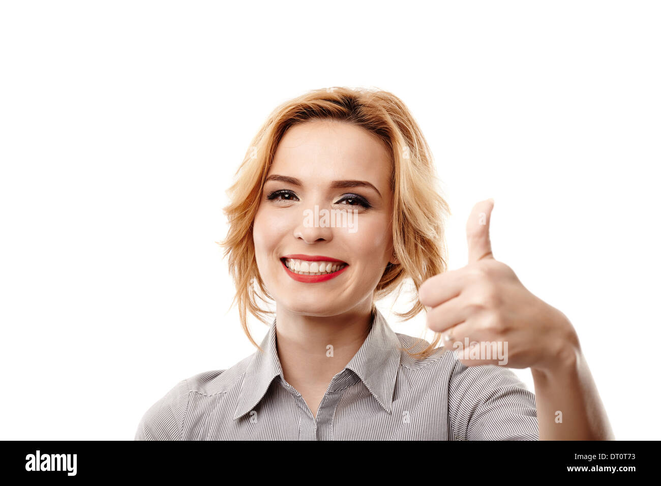 Closeup of young cheerful businesswoman making the finger up sign ...