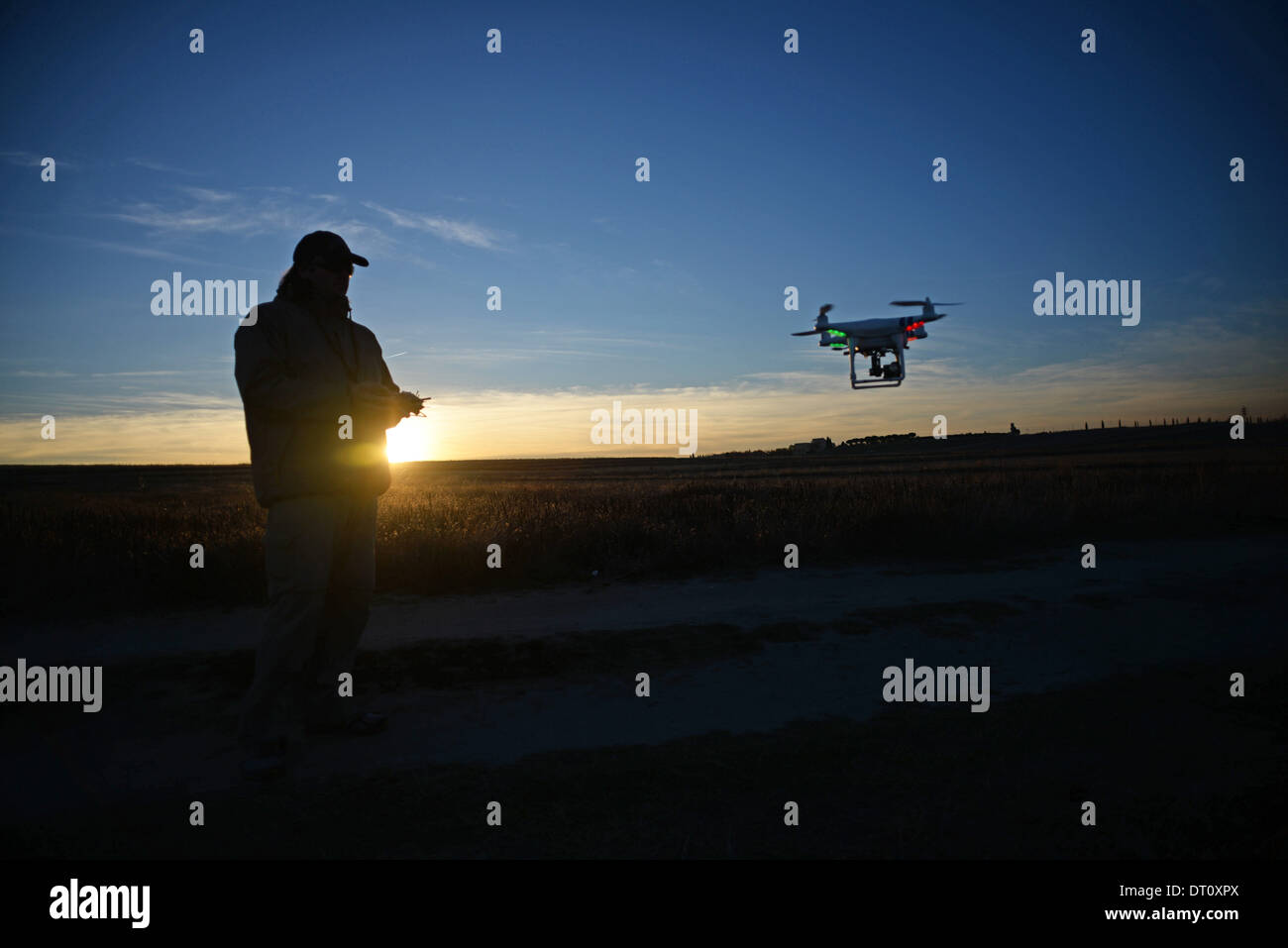 Silhouette young man flying drone hi-res stock photography and images ...