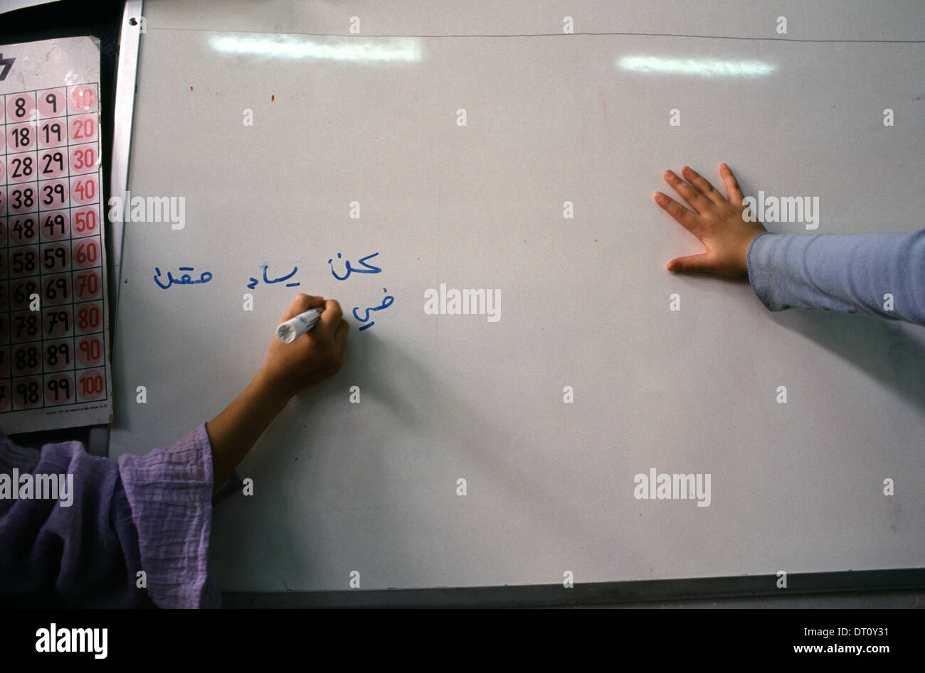 Muslim kid writing hi-res stock photography and images - Alamy