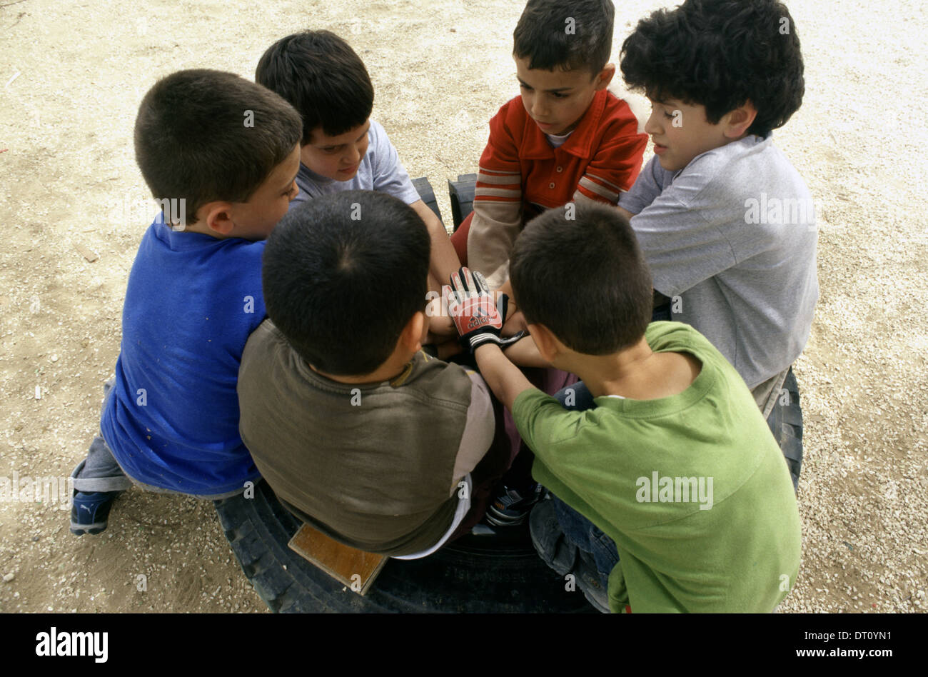 Israeli Jewish and Arab kids putting their hands together before ...