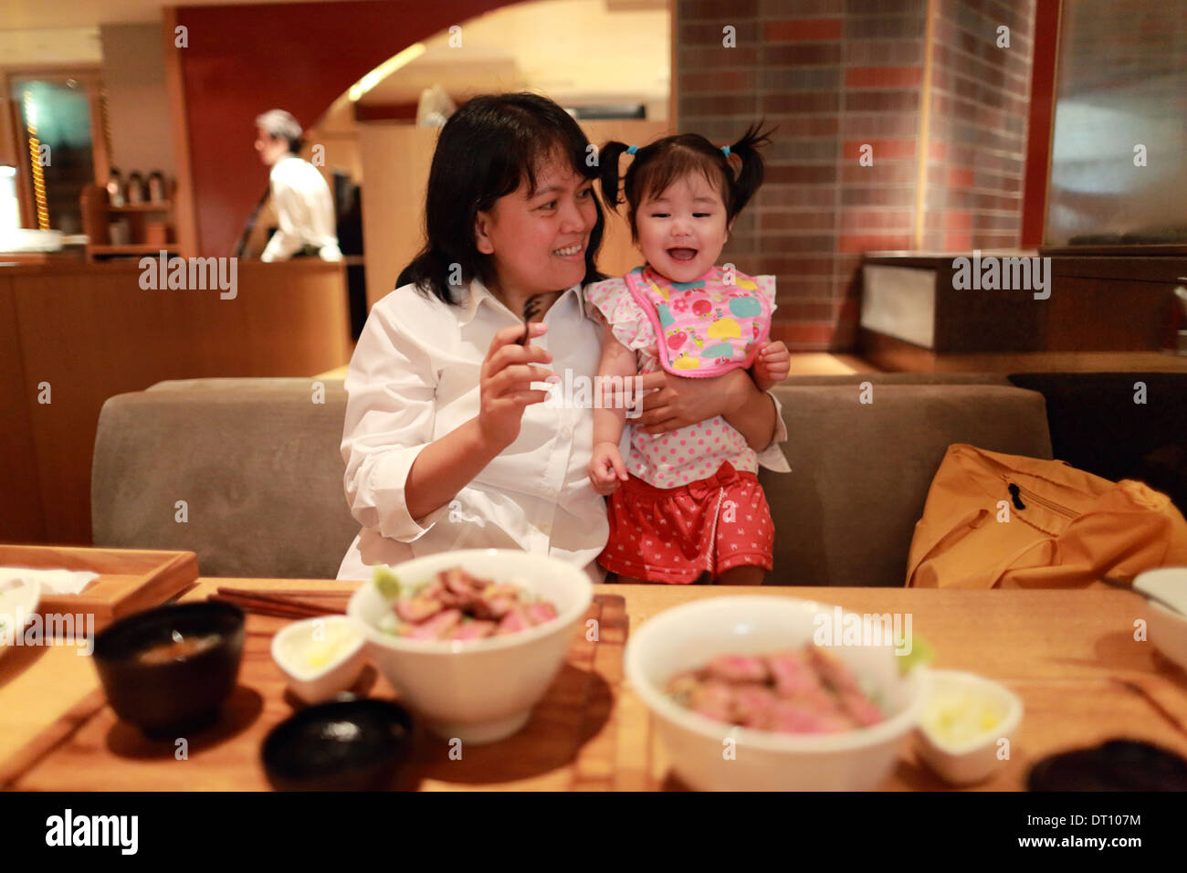 Mother and Child Bonding Moment in the Restaurant Stock Photo - Alamy
