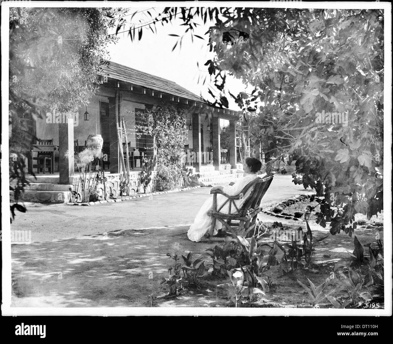 A photograph of the exterior front view of Casa Verdugo, an adobe house ...